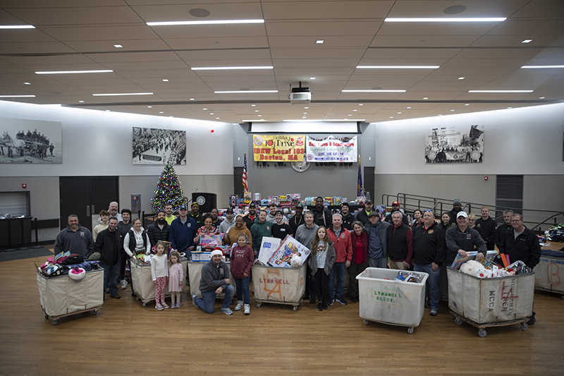 Local 103 electrical workers donate toys and winter clothes to children ...